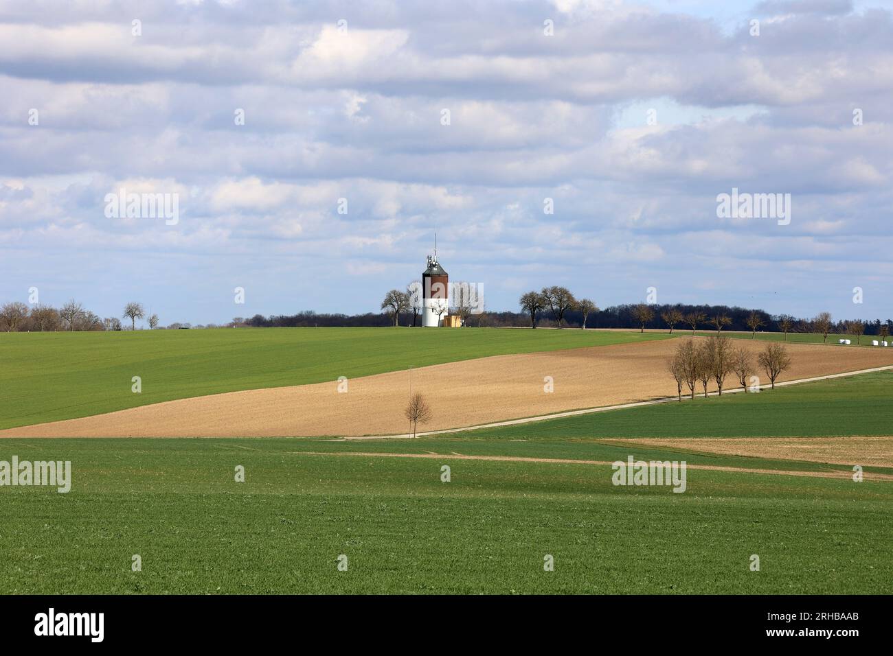Spring landscape with water tower Stock Photo - Alamy