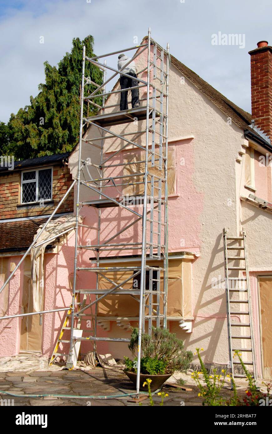 Household maintenance: a movable work platform in use to spray paint ...