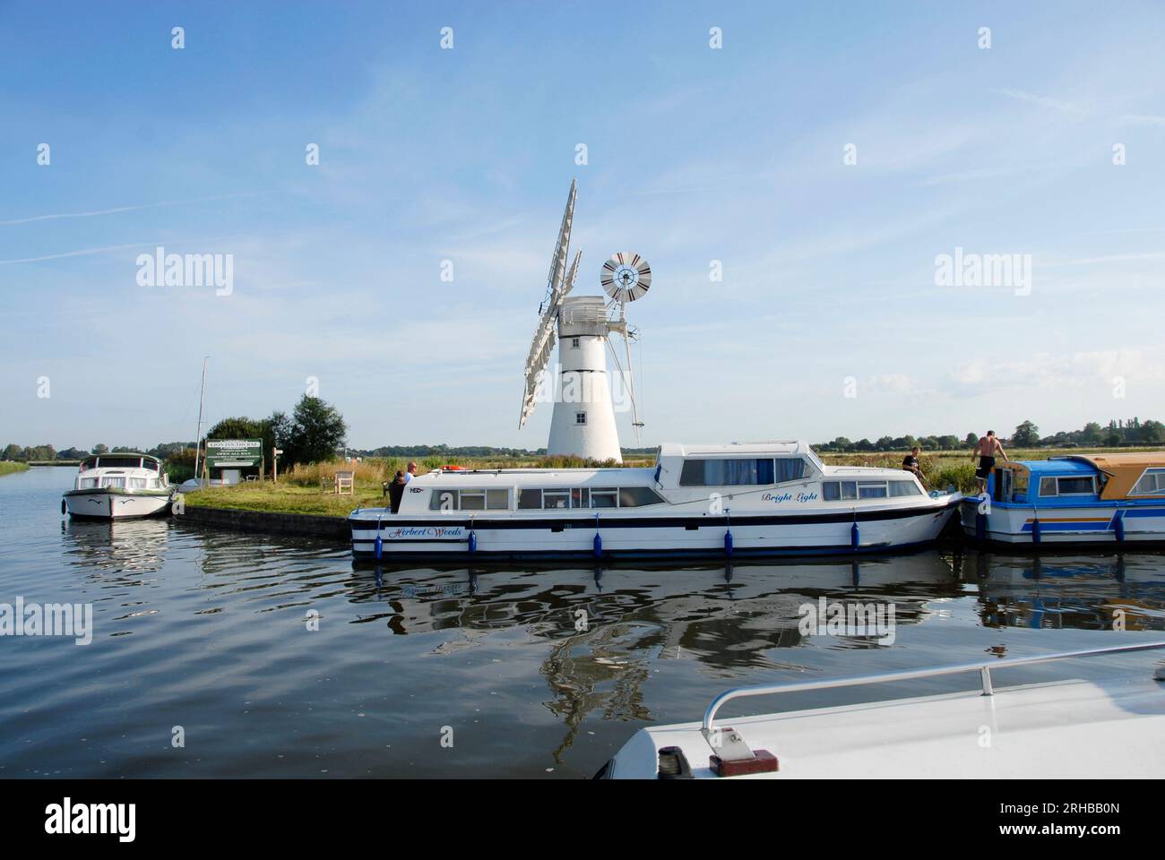 Hire vessels moored at Thurne Mill on the Norfolk Broads, a popular ...