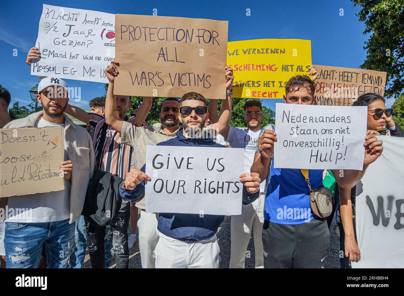 The Hague, Netherlands. 14th Aug, 2023. Students hold placards ...