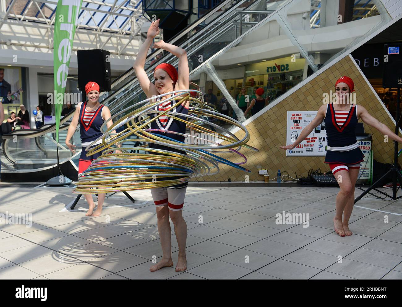 Hula hoop artists performing at shopping centre Britain, Uk Stock Photo ...