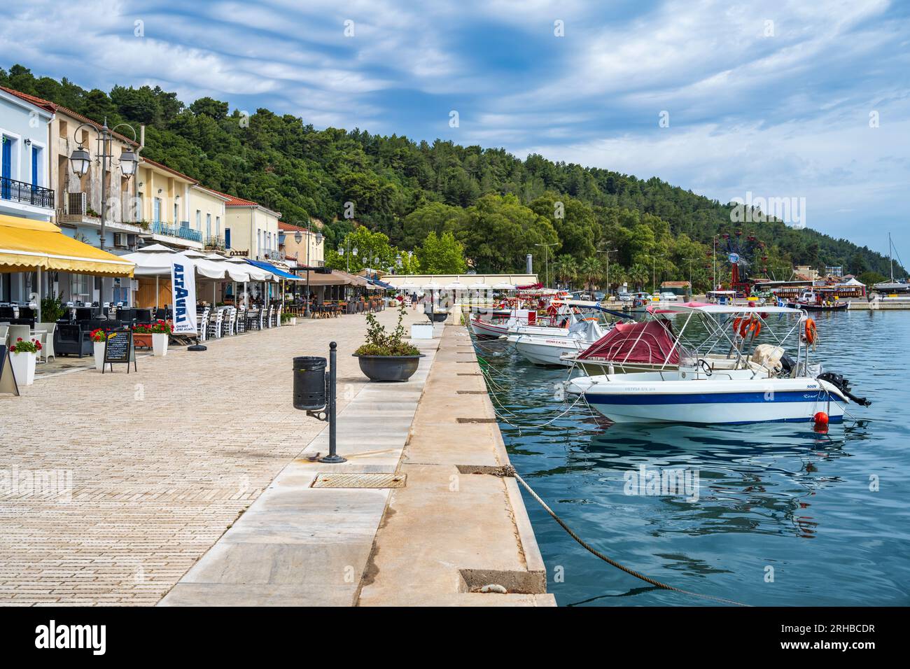 Boats moored on quayside of picturesque port town of Katakolon, gateway ...