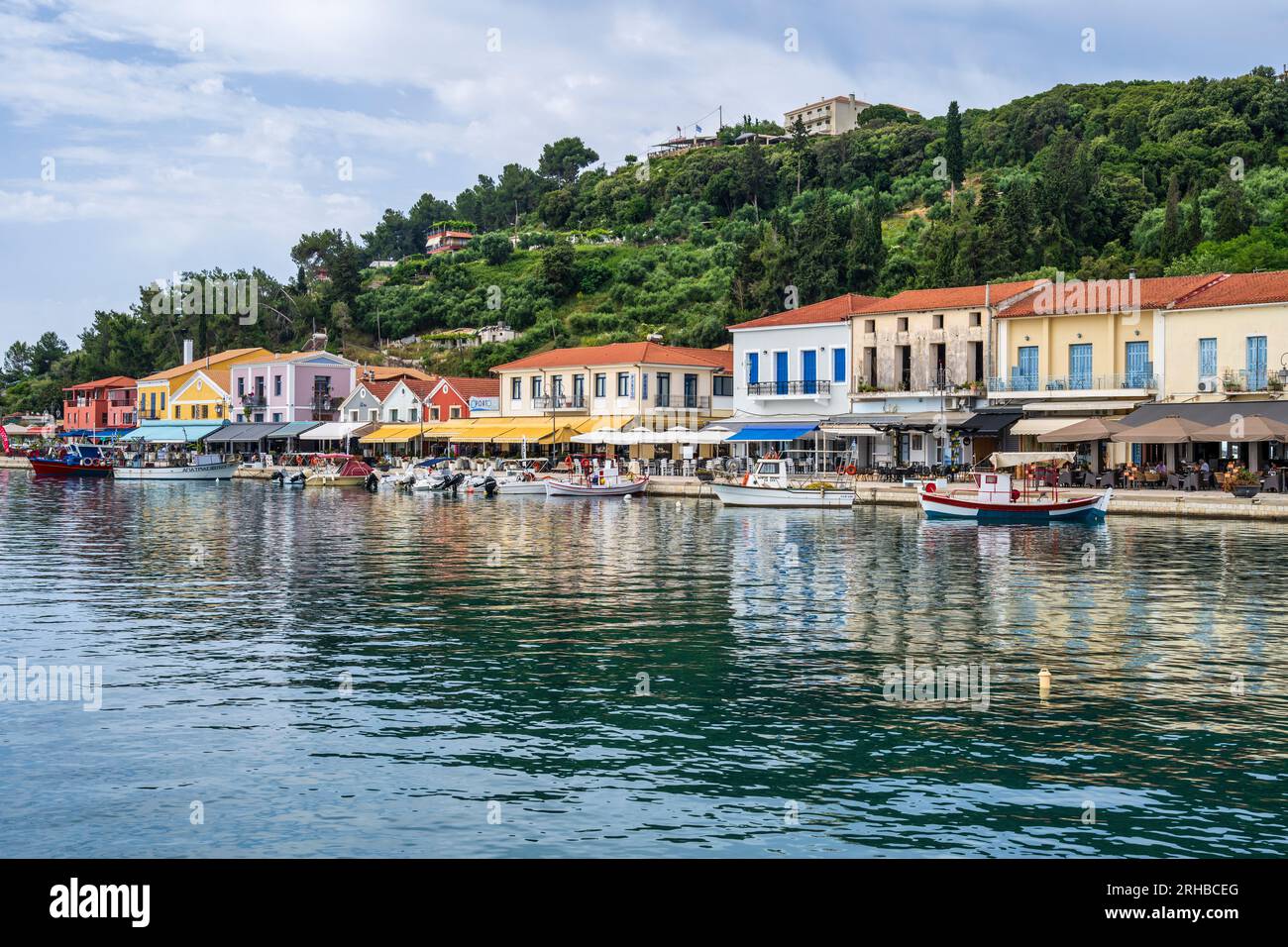Boats moored on quayside of picturesque port town of Katakolon, gateway ...