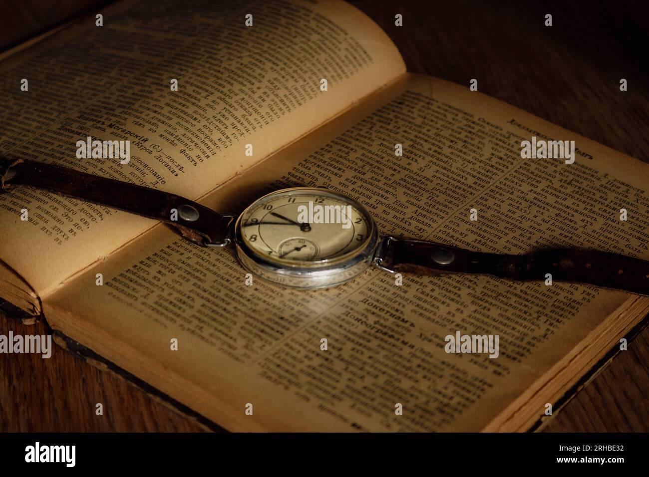 Antique pocket watch and ancient open book. Retro style objects ...