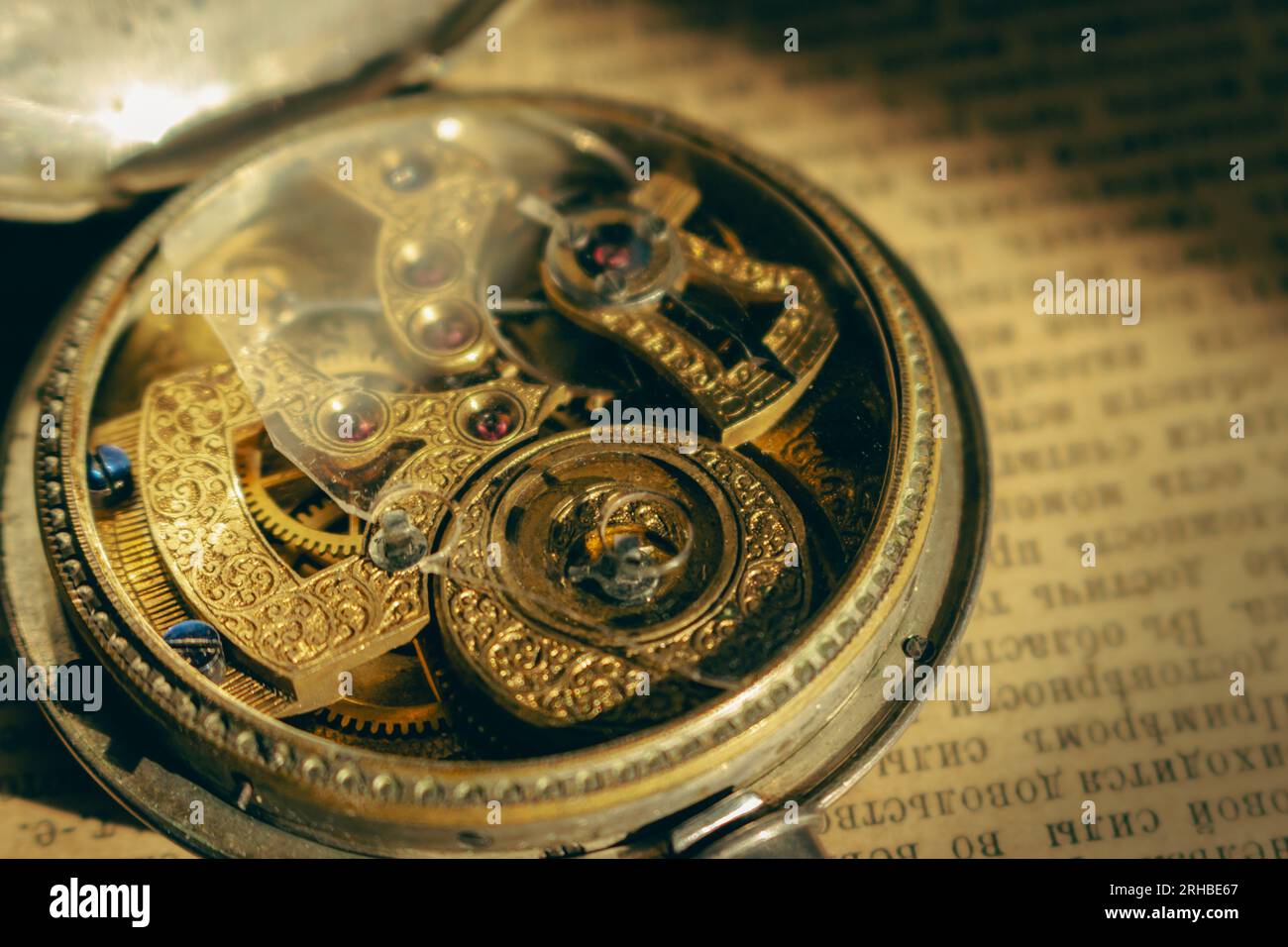 Antique pocket watch and ancient open book. Retro style objects ...