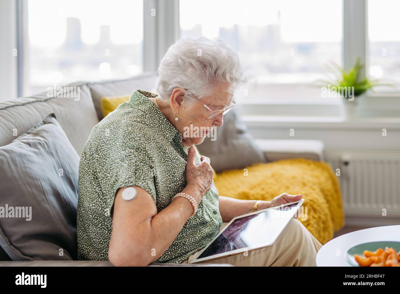 Diabetic senior patient with continuous glucose monitor feeling dizzy ...