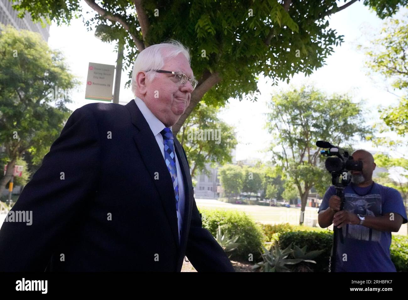 Orange County Superior Court Judge Jeffrey Ferguson, center, walks out ...
