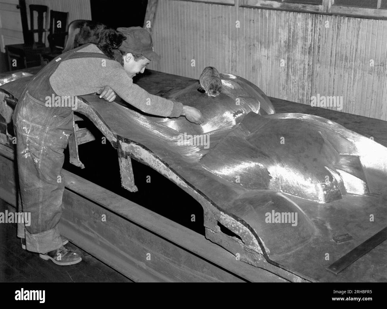 New York, New York: 1940 Isamu Noguchi playing with a cat on the ...