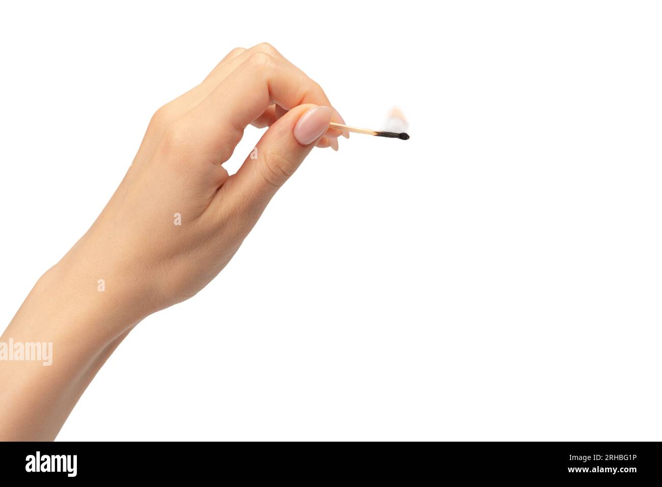 Lit match in a woman hand isolated on a white background. Copy space ...