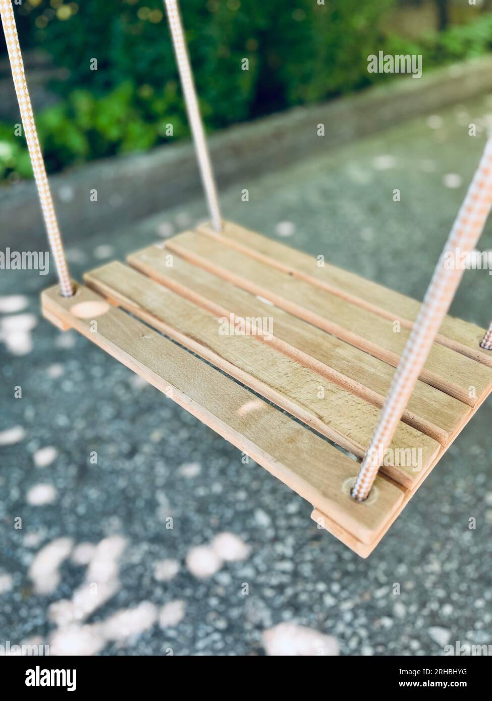 Swing in a playground summer a swing hanging seat hi-res stock ...