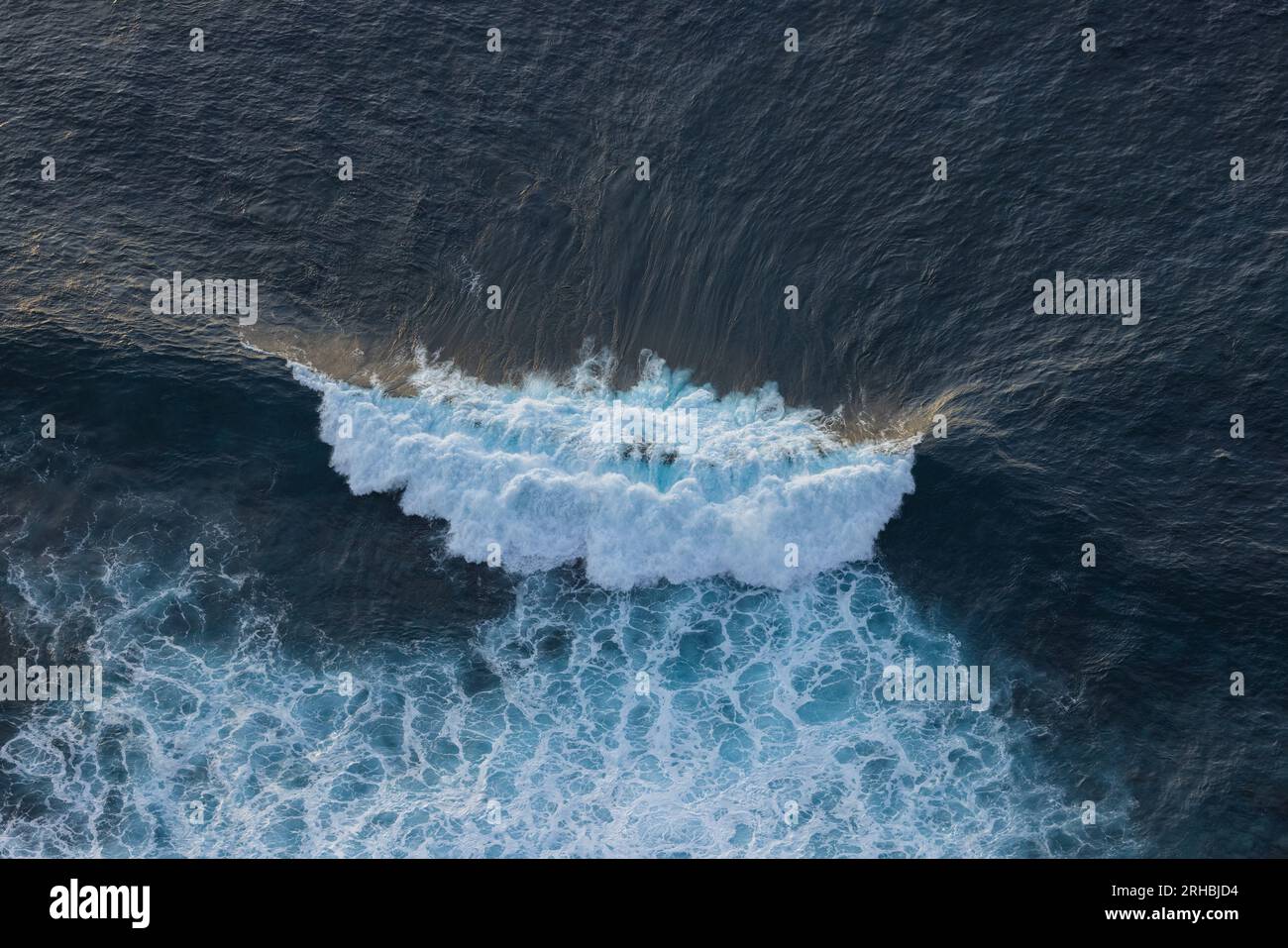 Great waves illuminated by the sun during sunset. Great waves that are ...