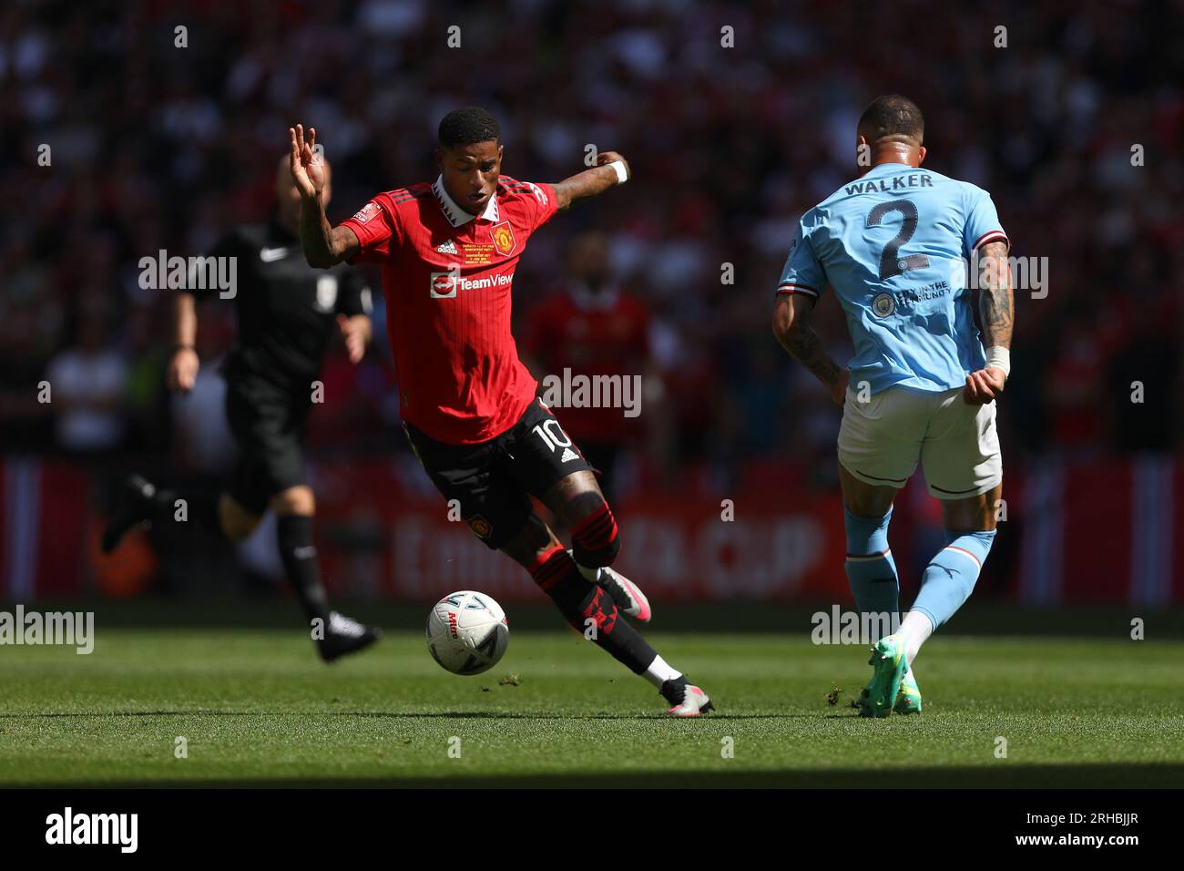 Marcus Rashford of Manchester United skips past Kyle Walker of ...