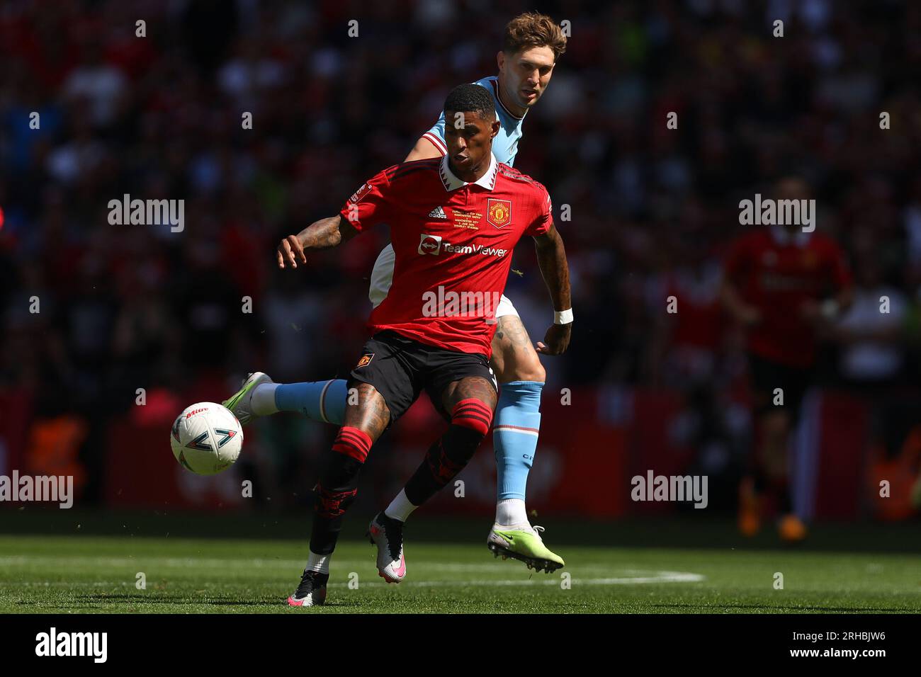 Marcus Rashford of Manchester United and John Stones of Manchester City ...