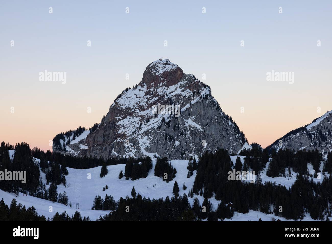 Amazing sunrise with a big mountain in front called Grosser Mythen with ...