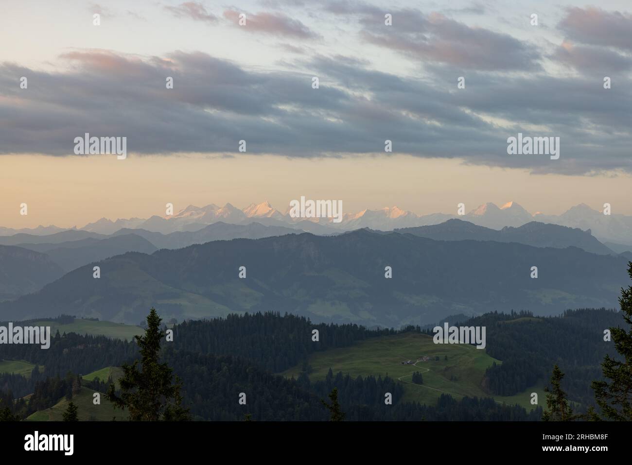 Amazing sunset at a wonderful landscape in Switzerland on a hill called ...