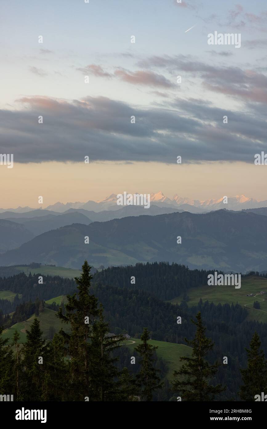 Amazing sunset at a wonderful landscape in Switzerland on a hill called ...