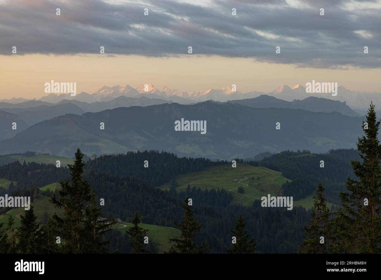 Amazing sunset at a wonderful landscape in Switzerland on a hill called ...
