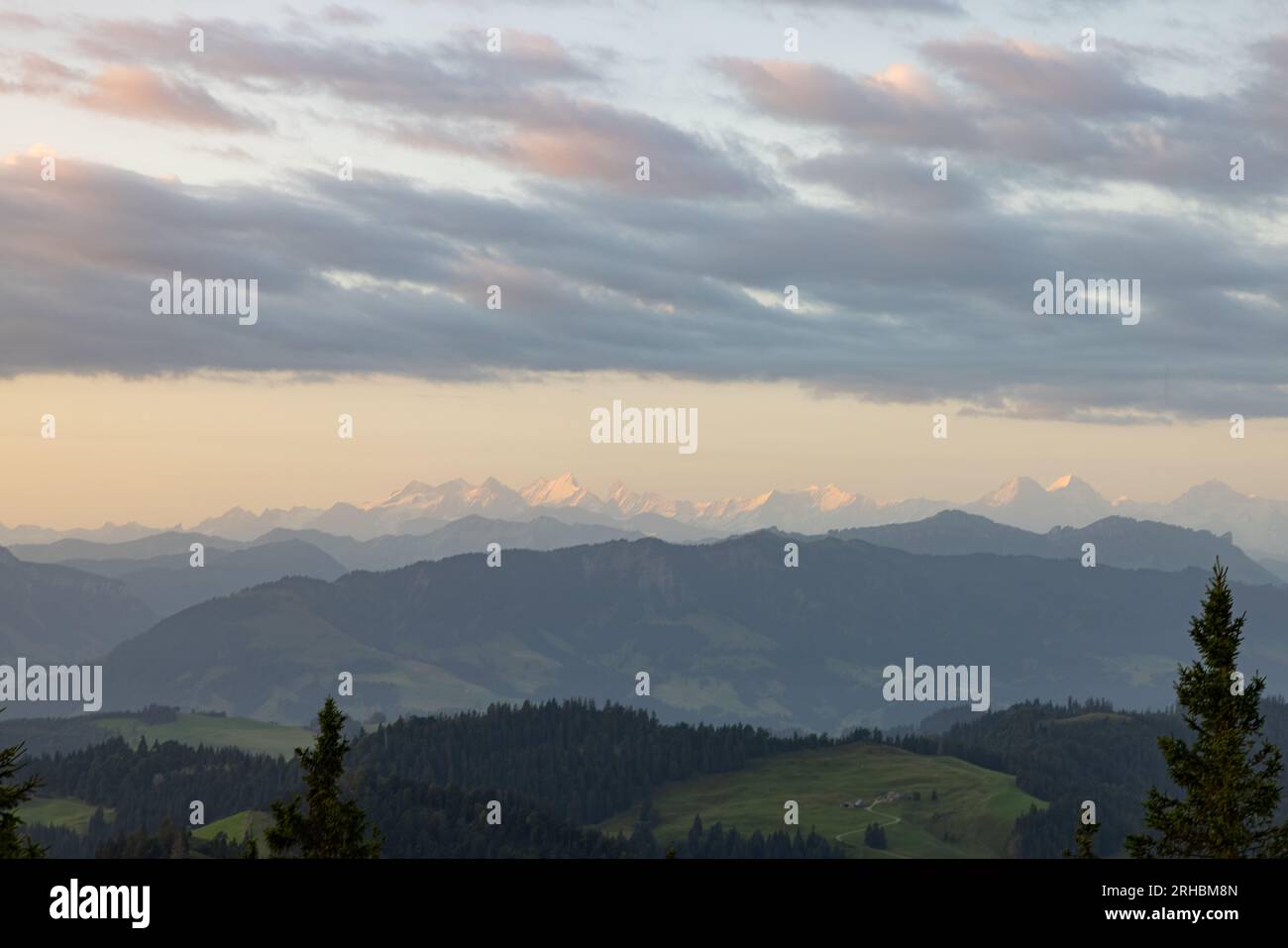 Amazing sunset at a wonderful landscape in Switzerland on a hill called ...