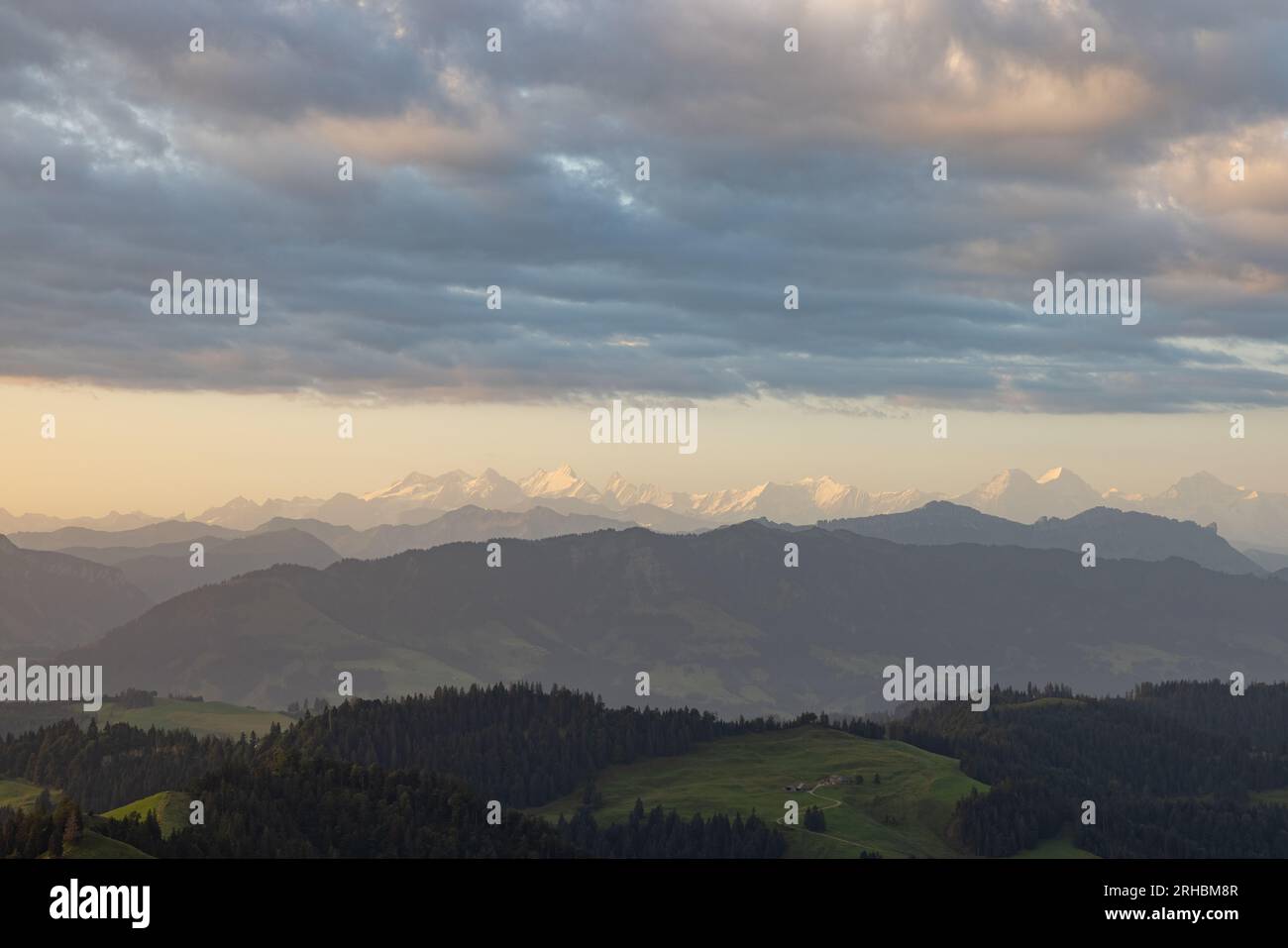 Amazing sunset at a wonderful landscape in Switzerland on a hill called ...