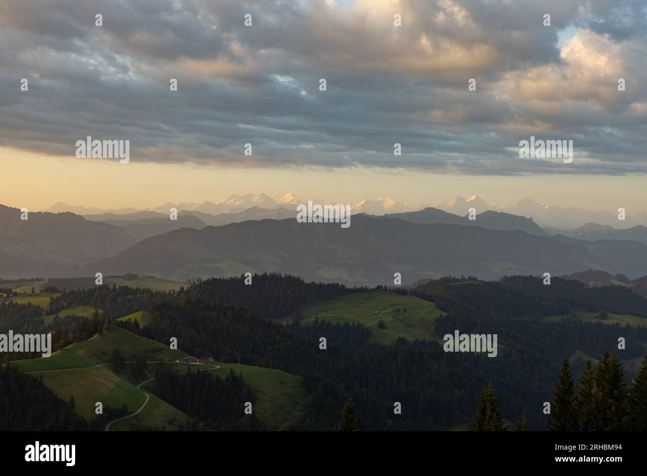 Amazing sunset at a wonderful landscape in Switzerland on a hill called ...