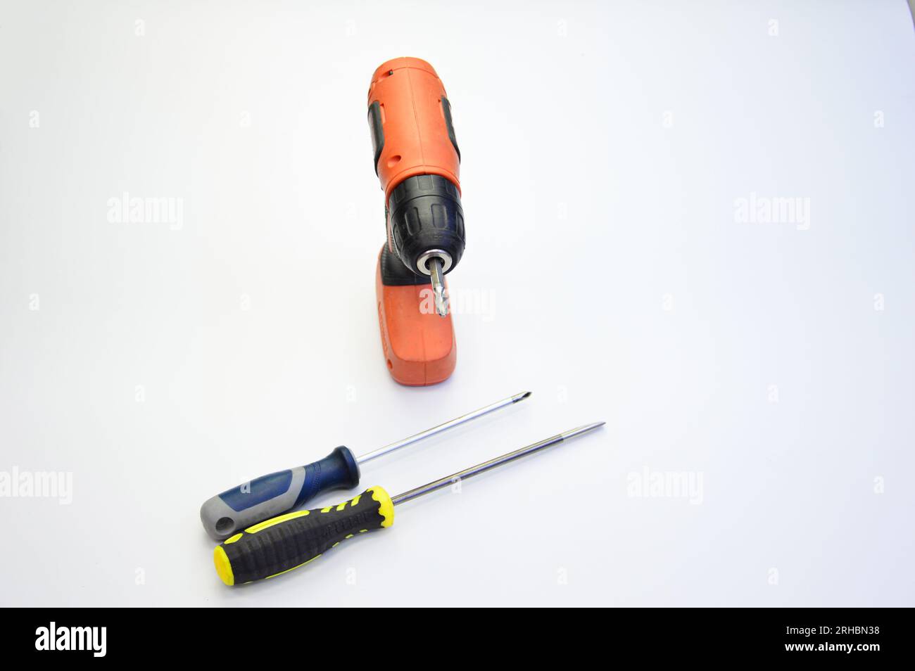 Electric screwdriver and hand screwdriver set on white background Stock ...
