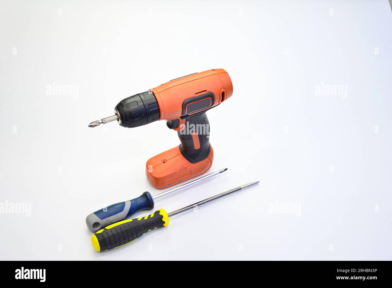 Electric screwdriver and hand screwdriver set on white background Stock ...
