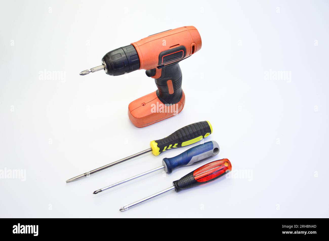 Electric screwdriver and hand screwdriver set on white background Stock ...