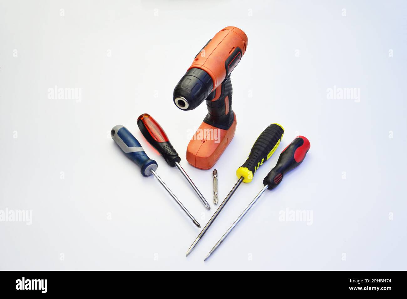 Electric screwdriver and hand screwdriver set on white background Stock ...