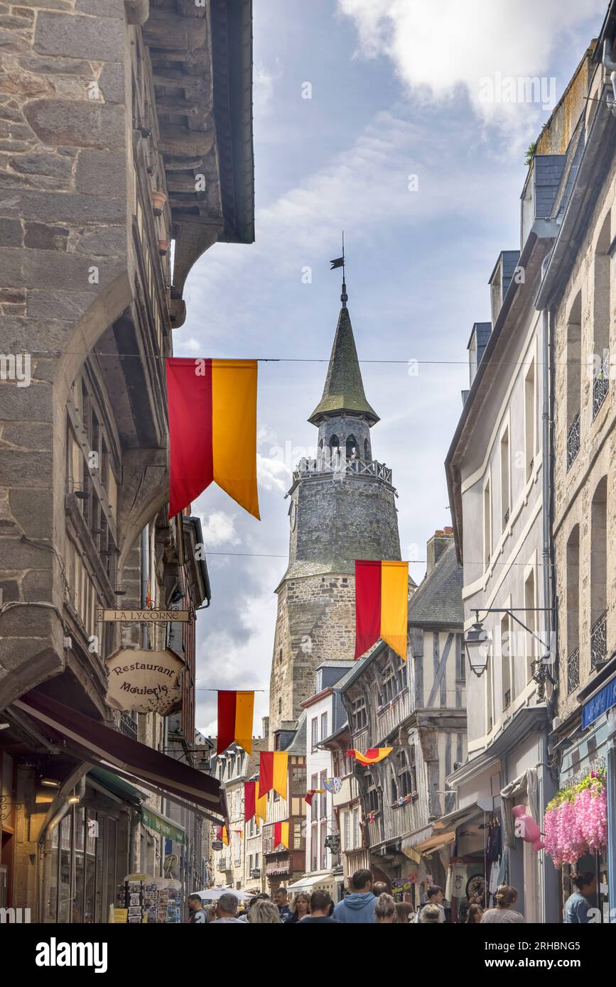 narrow ancient streets flags and the clocktower in dinan town in ...