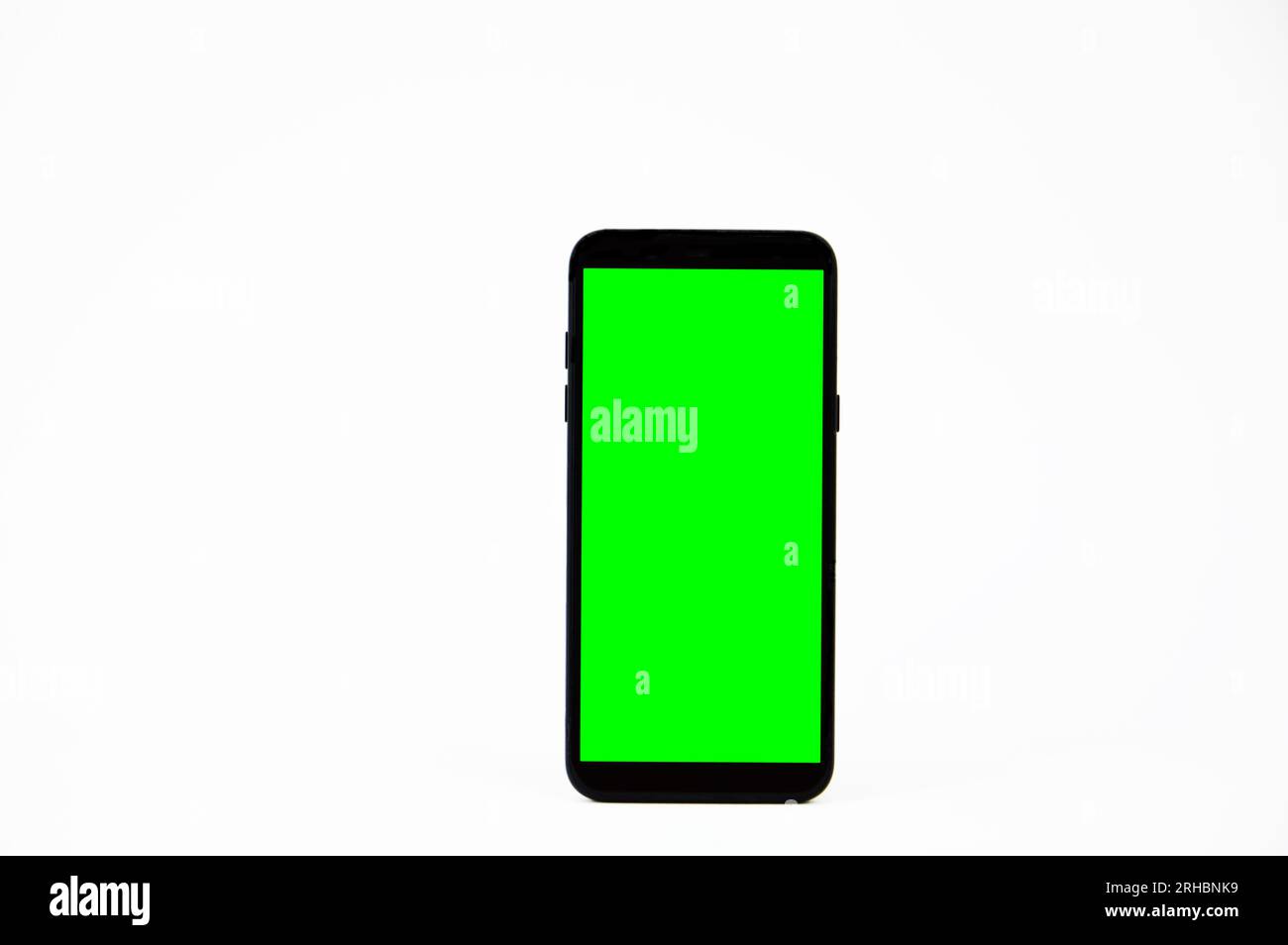 Green screen smartphone on white background Stock Photo - Alamy