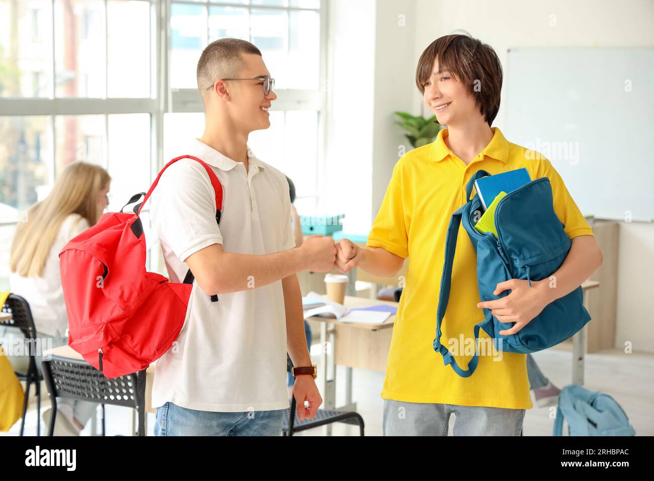 Girl bumping into boy hi-res stock photography and images - Alamy