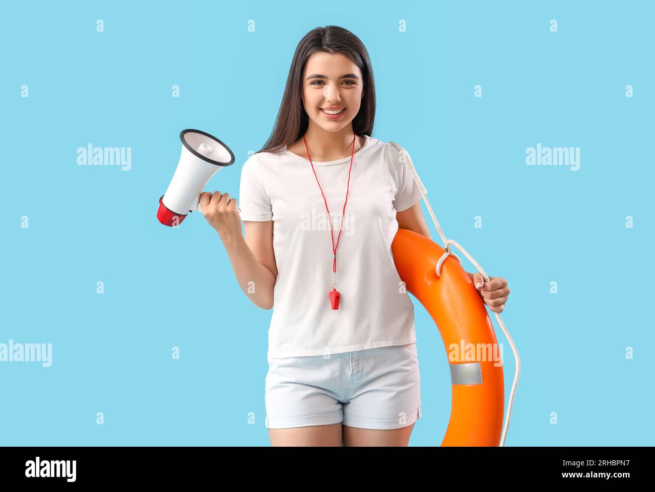 Female lifeguard with ring buoy and megaphone on blue background Stock ...