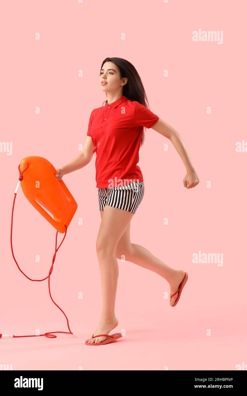 Lifeguard running into the sea hi-res stock photography and images - Alamy