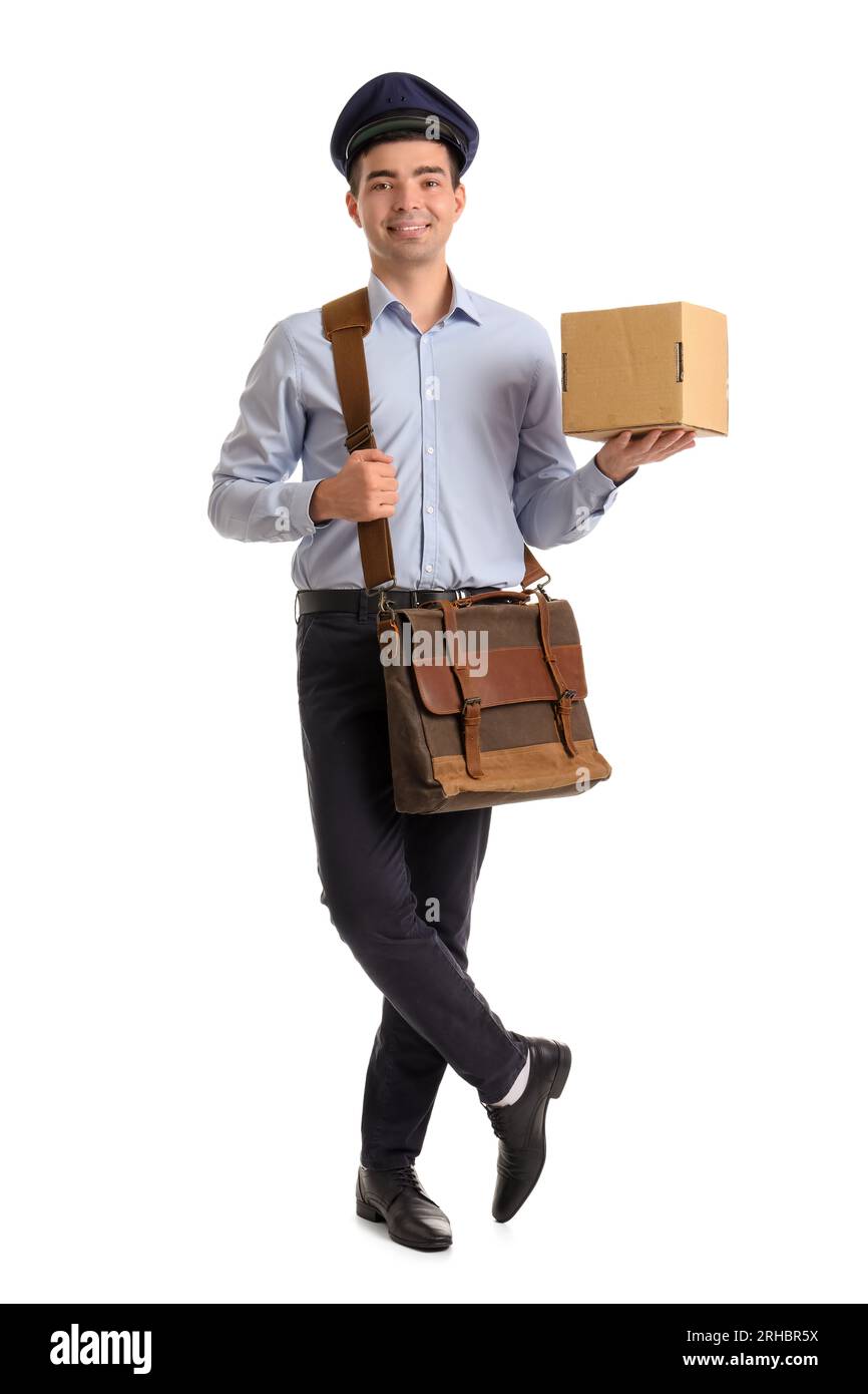 Young postman with parcel on white background Stock Photo - Alamy