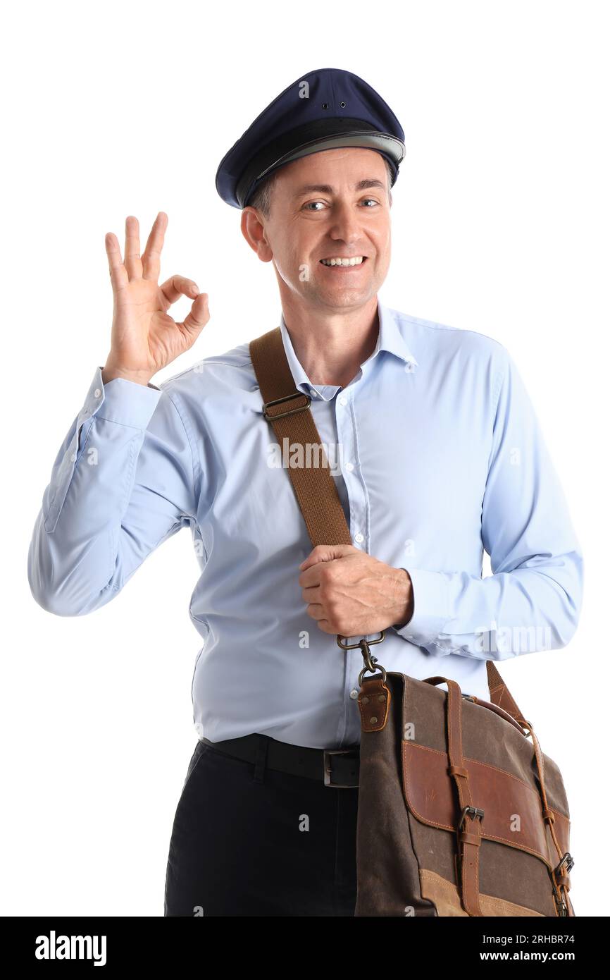 Mature postman showing OK on white background Stock Photo - Alamy