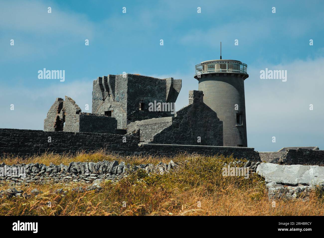Ancient Irish Structure and Modern Tower Stock Photo - Alamy