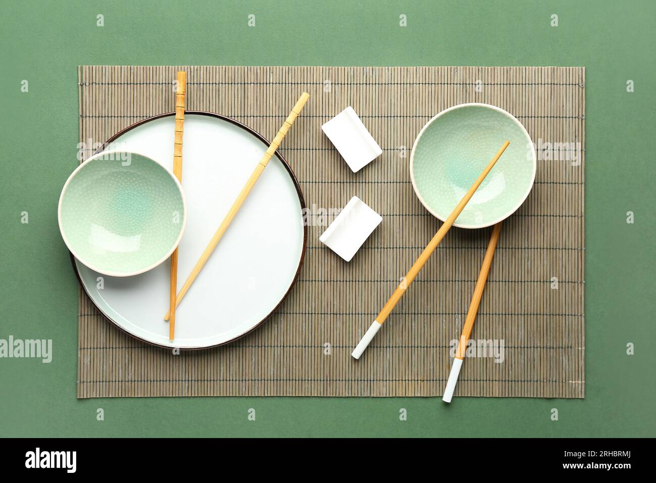 Chinese table setting on green background Stock Photo - Alamy