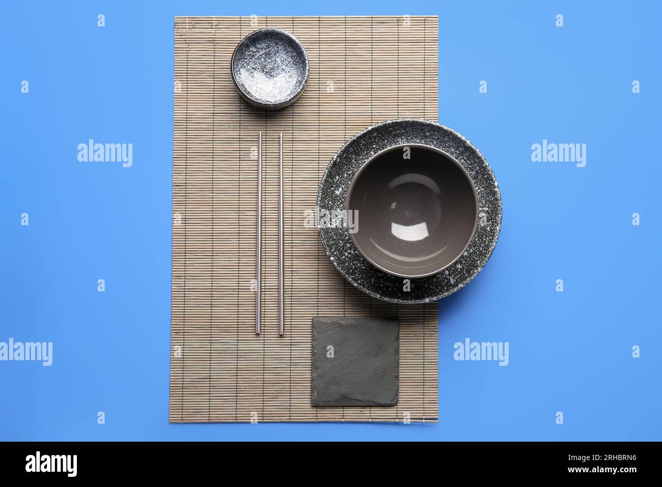 Chinese table setting on blue background Stock Photo - Alamy