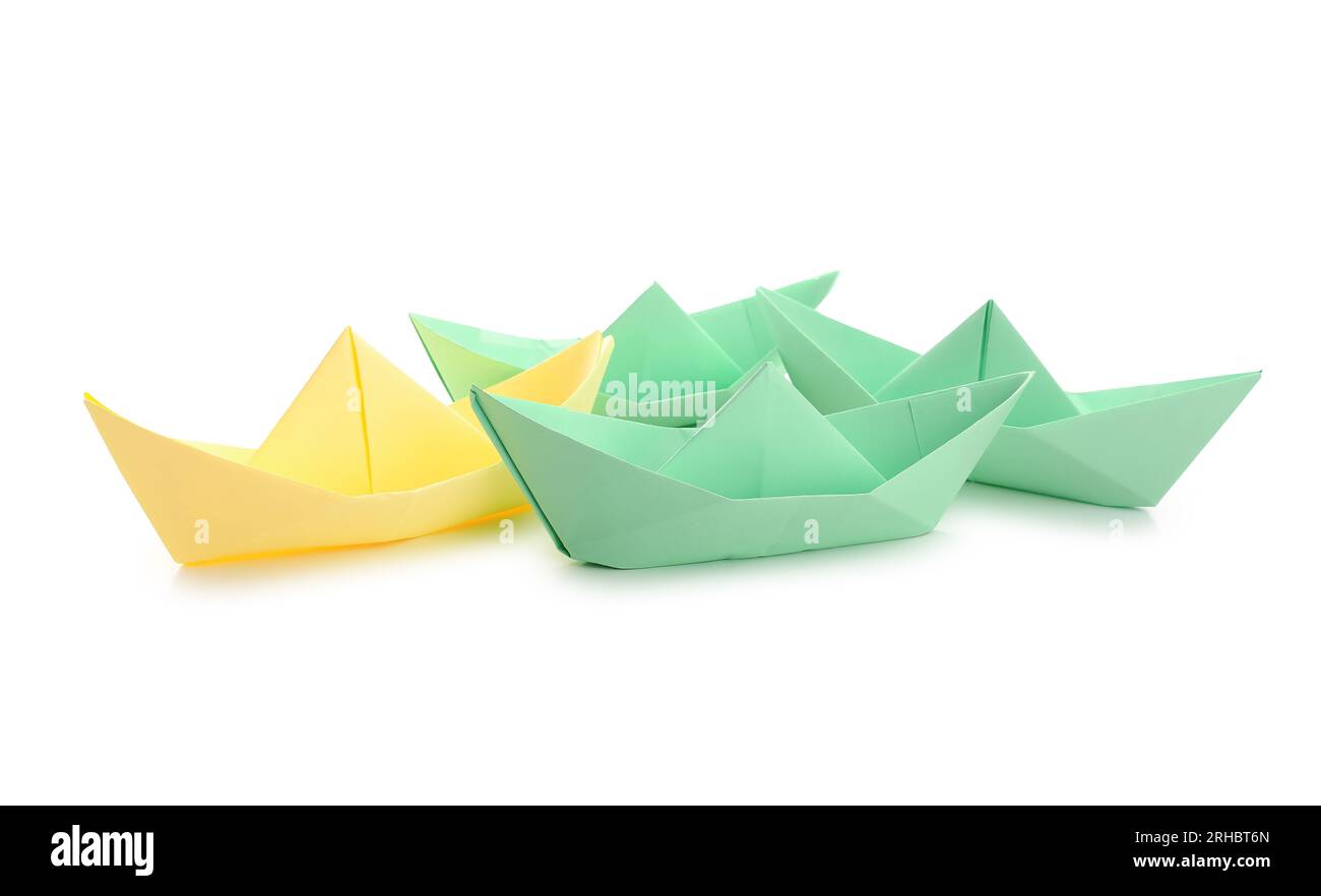Colorful origami boats on white background Stock Photo - Alamy