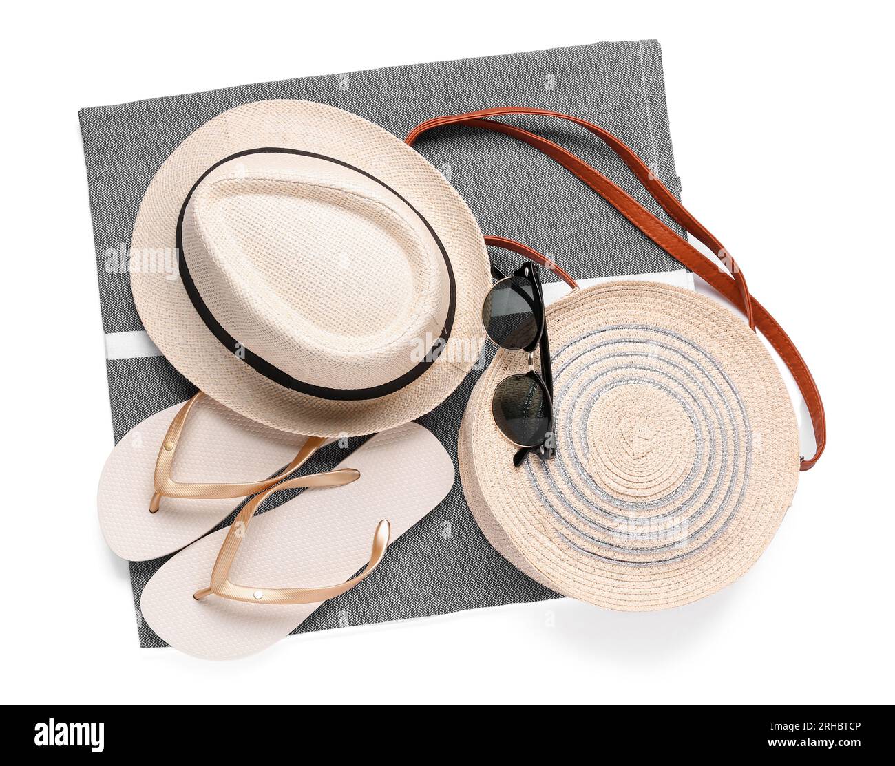 Stylish beach hat, bag, flip flops and sunglasses on white background ...