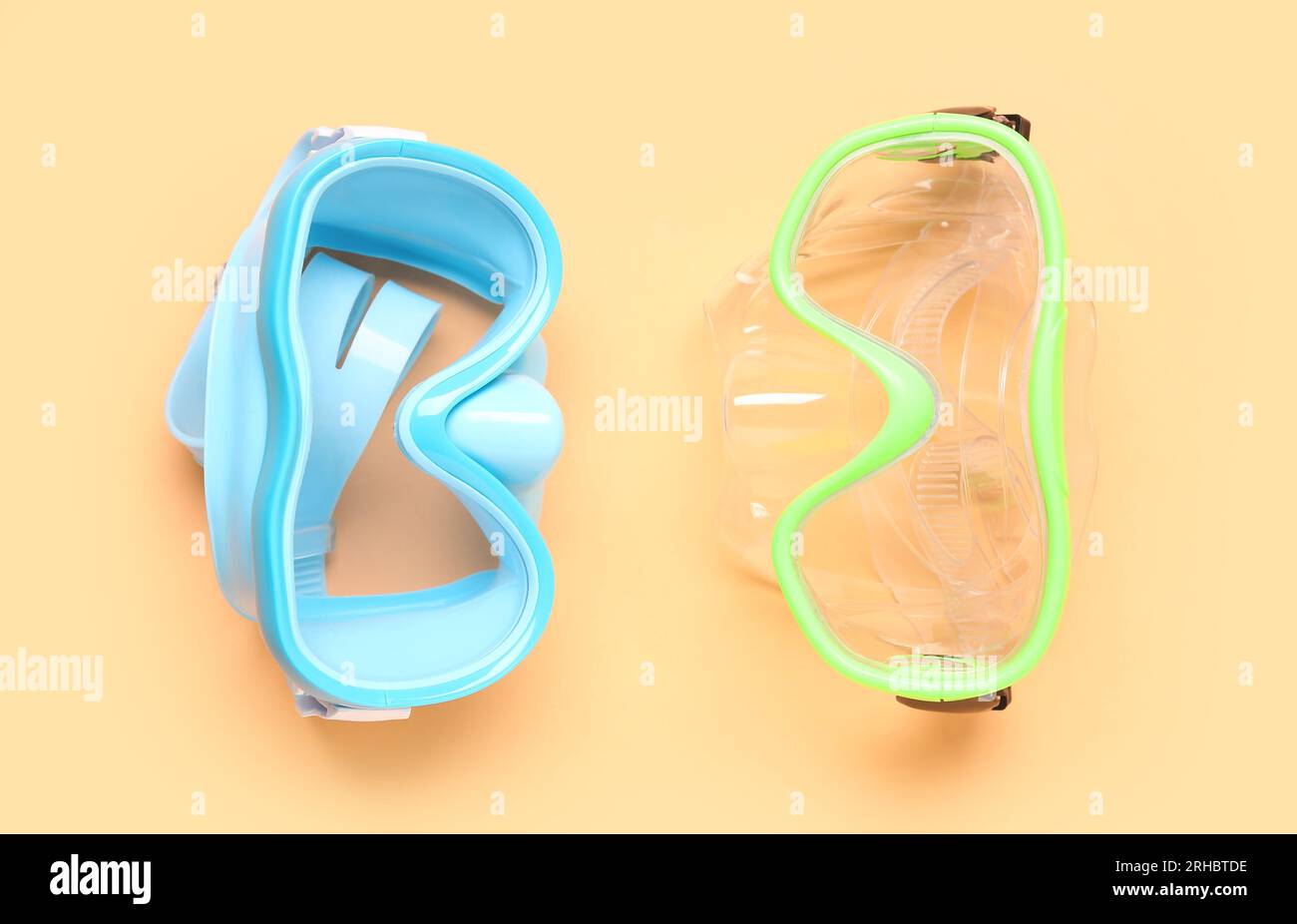 Different swimming masks on beige background Stock Photo - Alamy