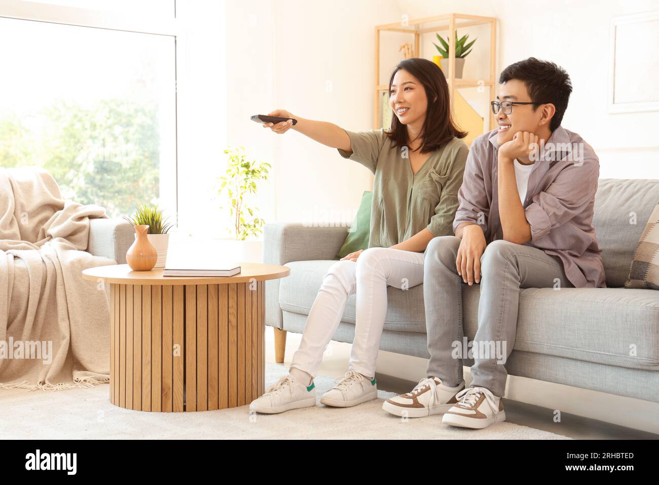 Portrait of couple watching tv korean hi-res stock photography and images - Alamy
