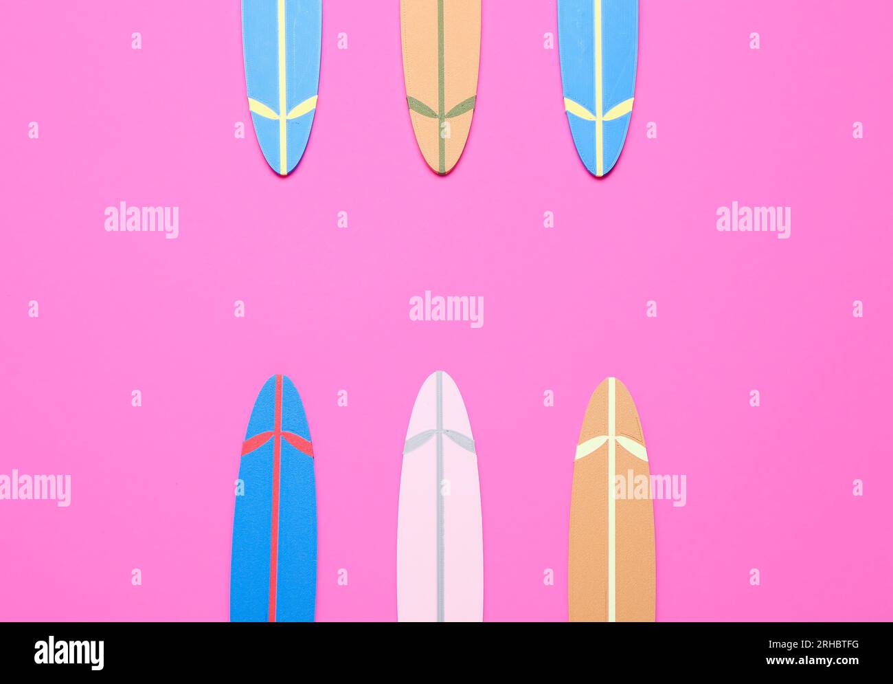 Different mini surfboards on pink background Stock Photo - Alamy