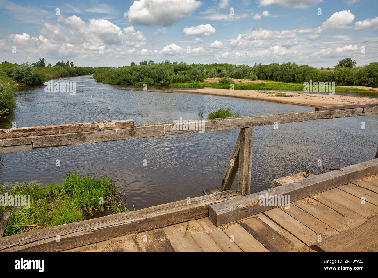 Old wooden bridge over Sluch river. Liukhcha village in Rivne region ...