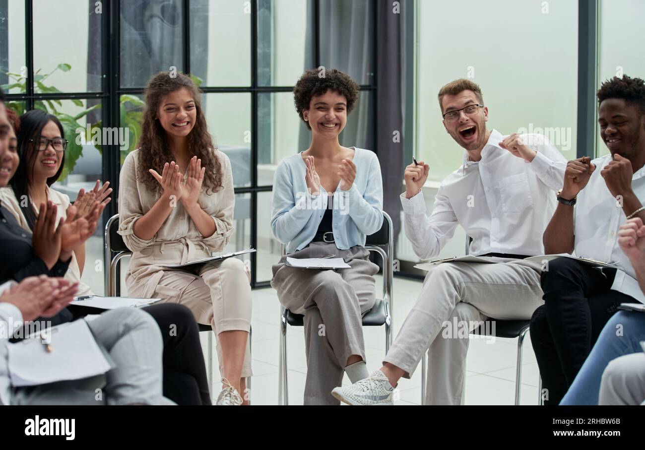 Business people with raised arms during seminar Stock Photo - Alamy
