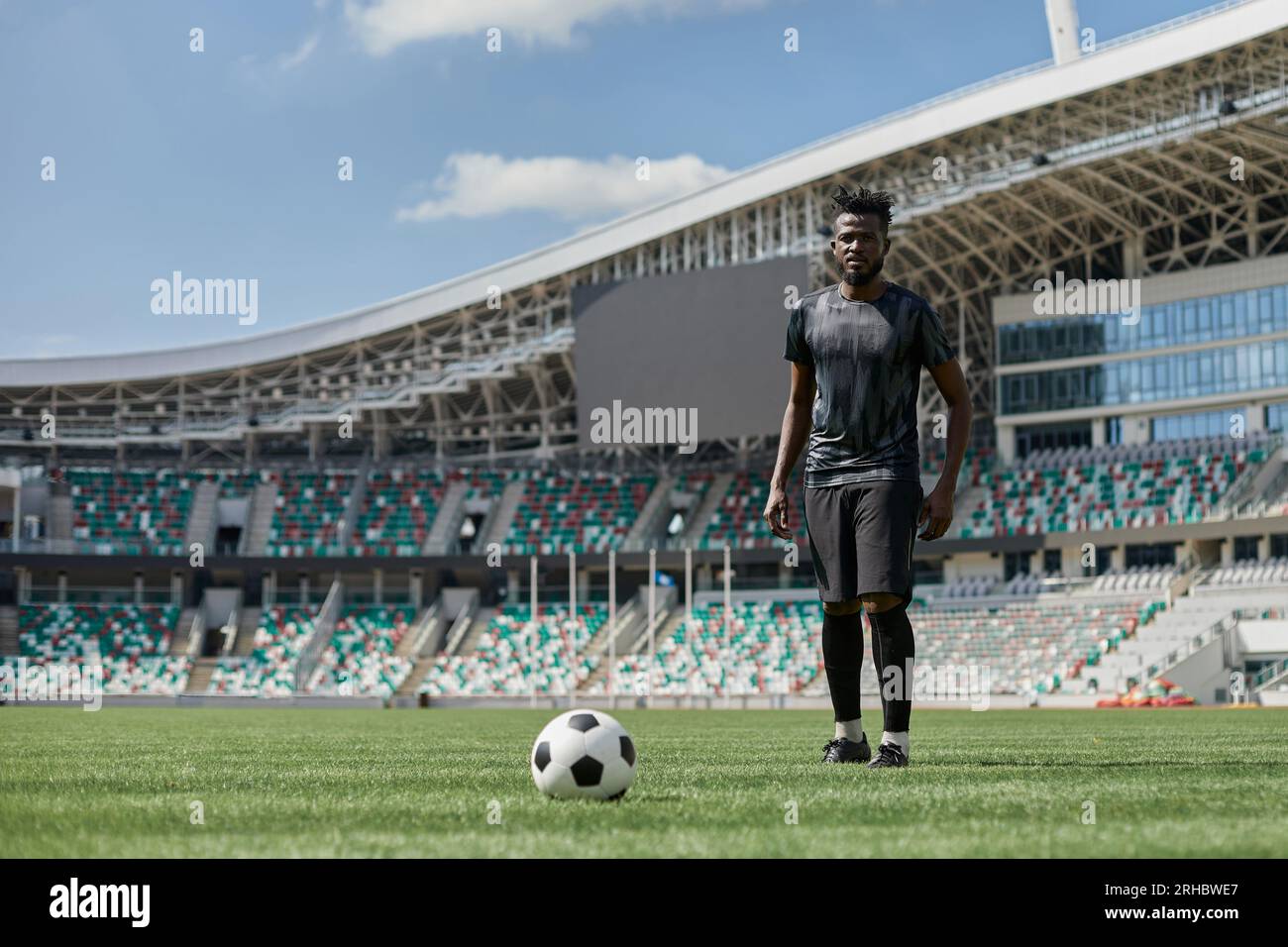 Professional male football, soccer player on stadium background ...