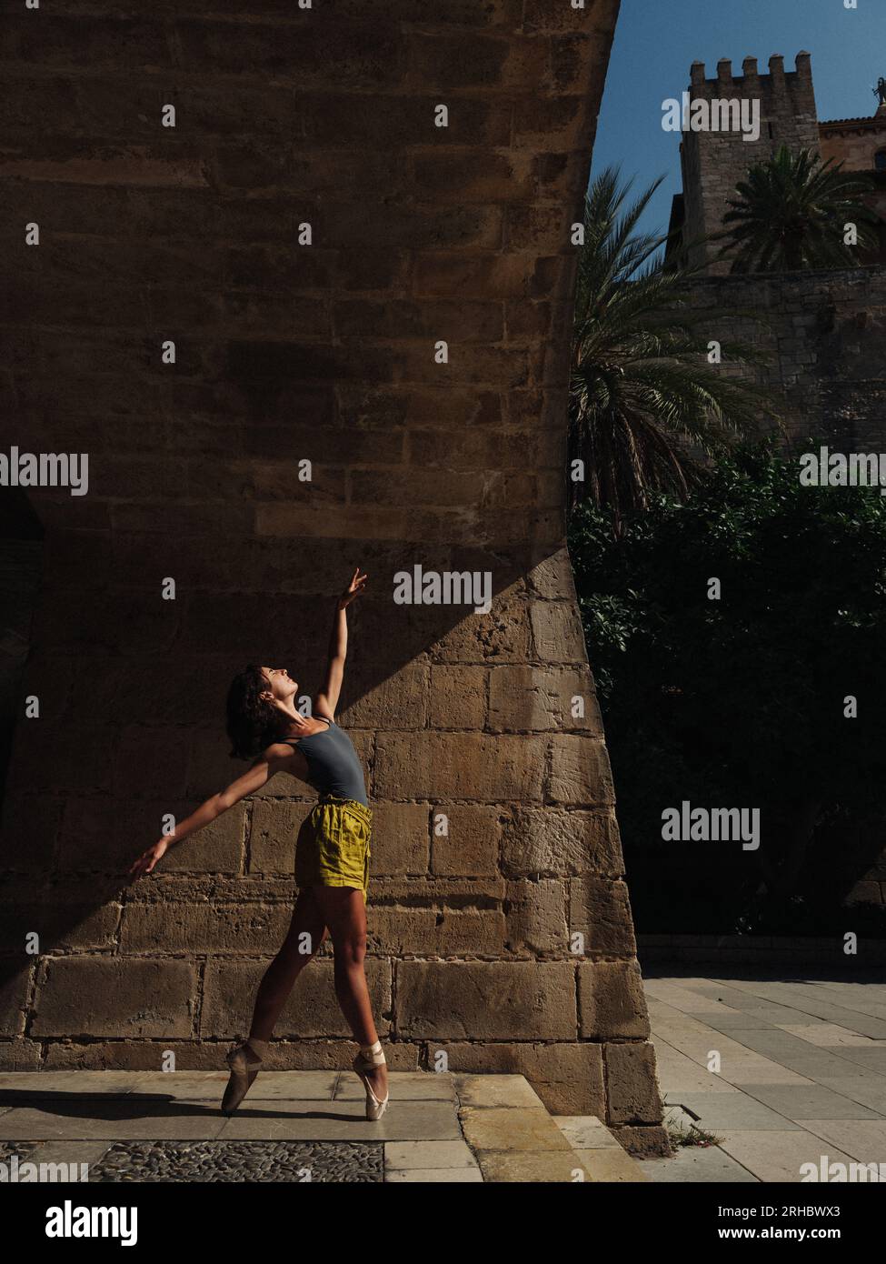 Full body side view of unrecognizable female dancer in pointe shoes ...