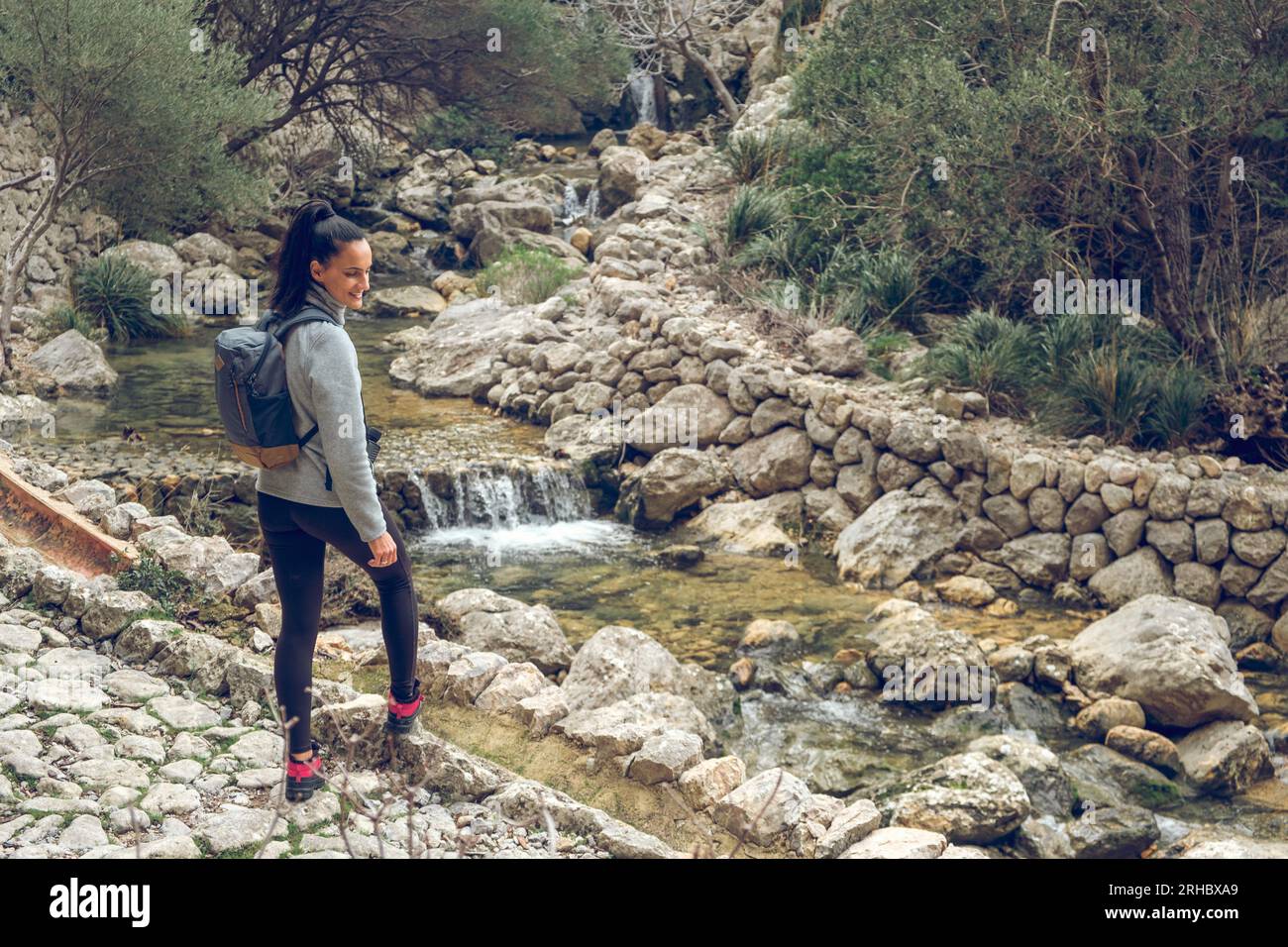 Woman walking down narrow rocky hi-res stock photography and images - Alamy