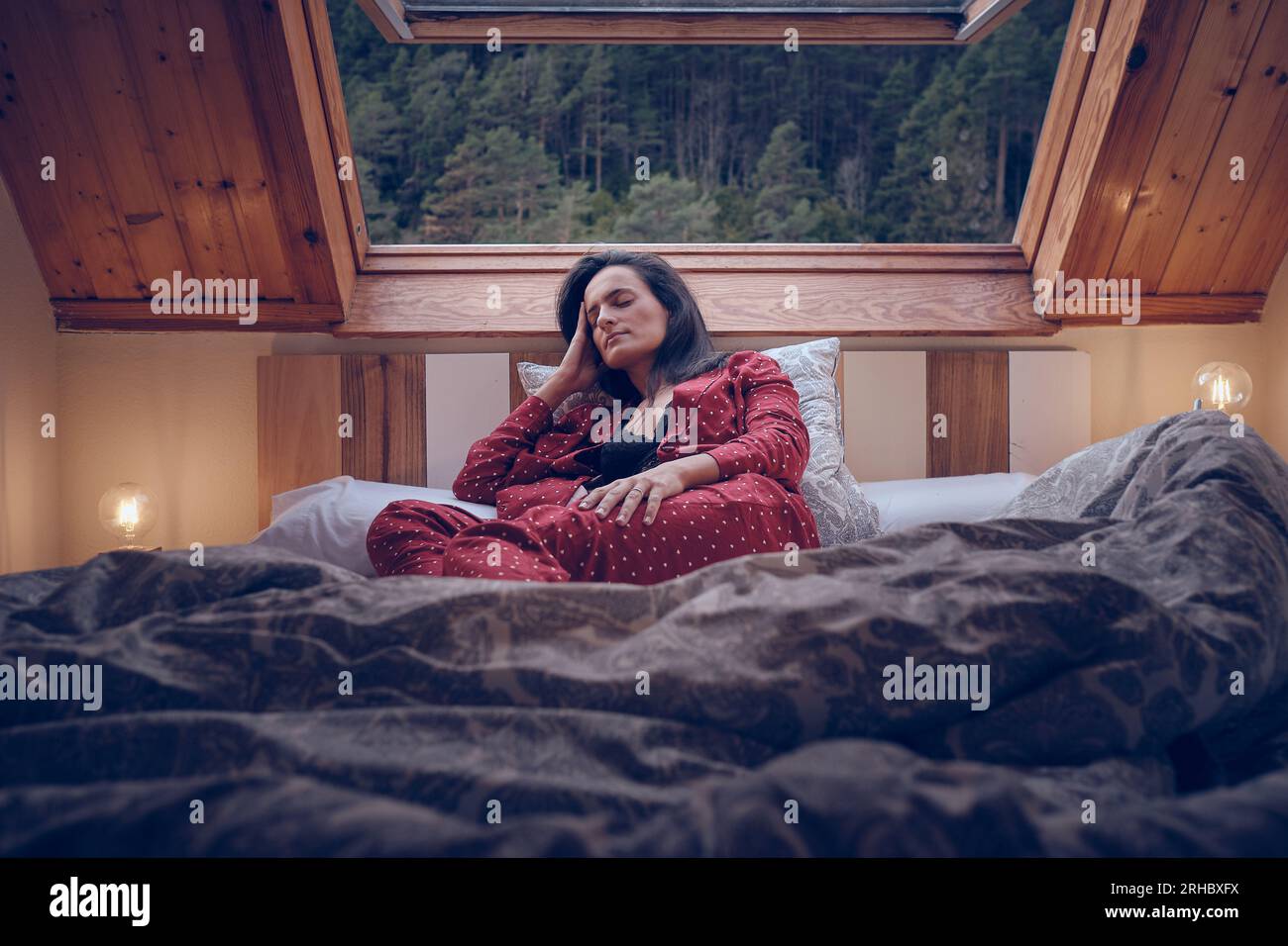 Woman sleeping in bed near window hi-res stock photography and images ...