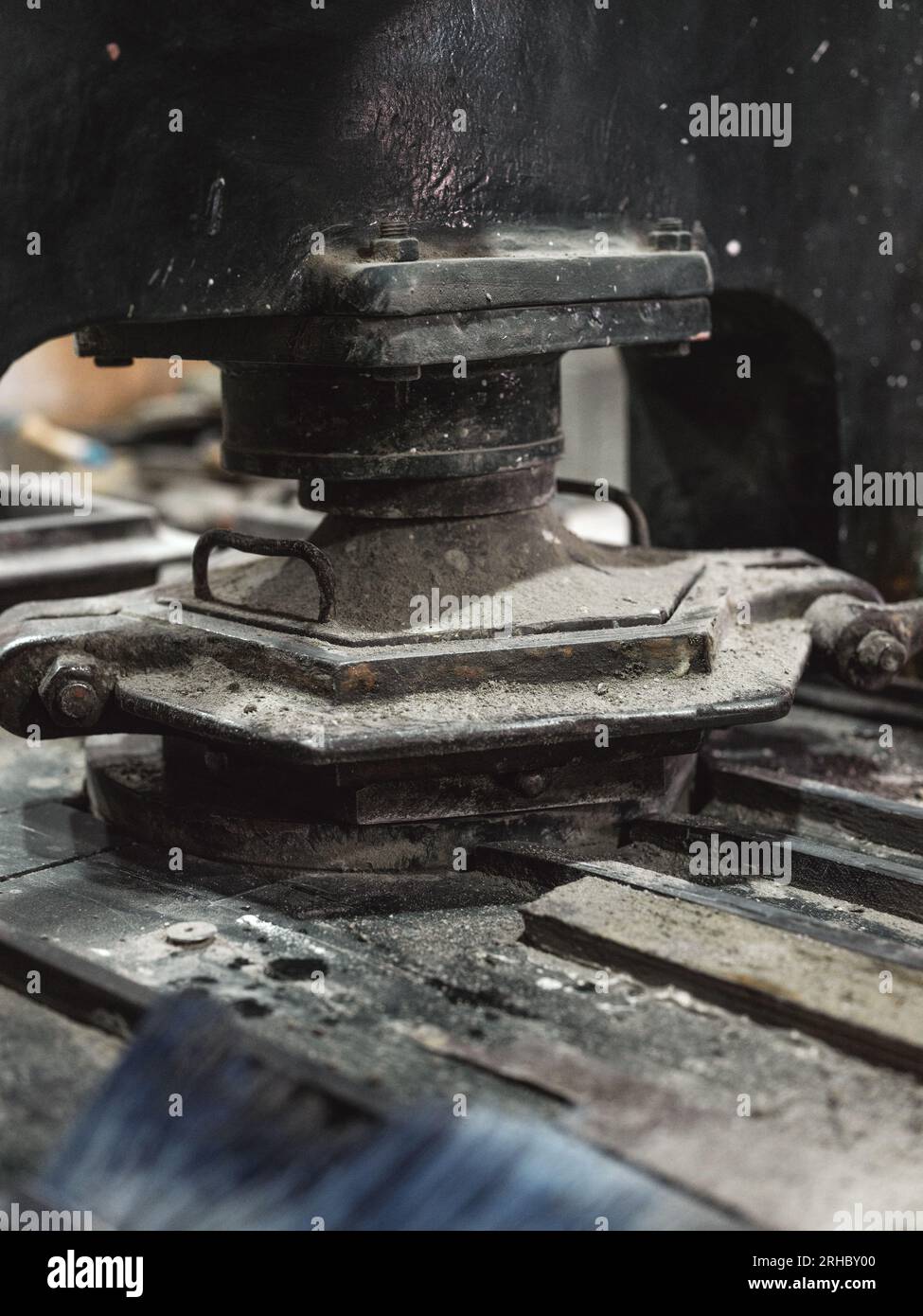 Weathered metal part of industrial pressing machine pressing ceramic ...